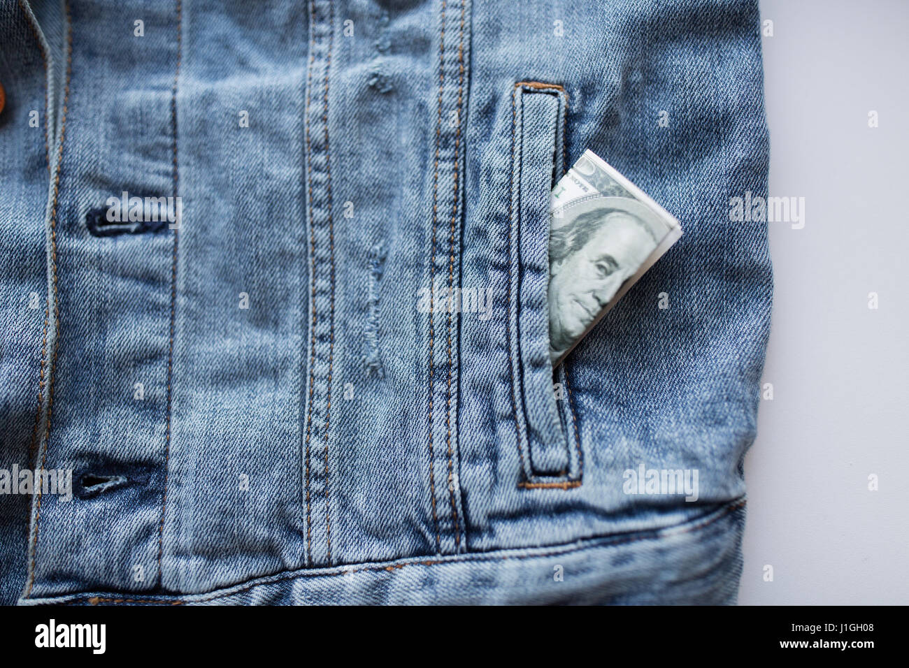 dollar money in pocket of denim jacket Stock Photo - Alamy