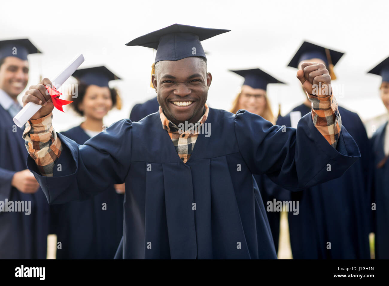 happy student with diploma celebrating graduation Stock Photo - Alamy