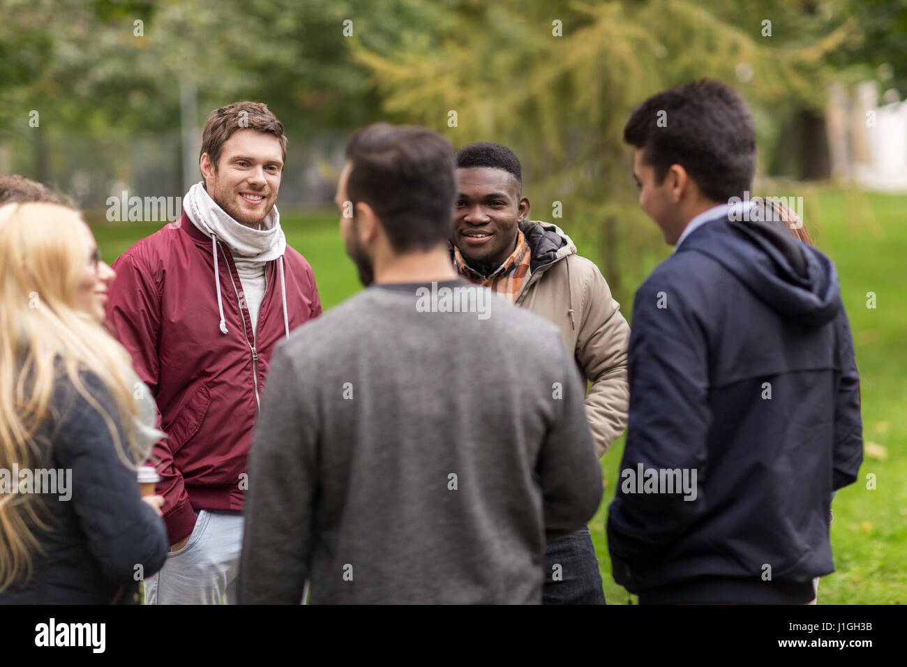 group of happy international friends outdoors Stock Photo - Alamy