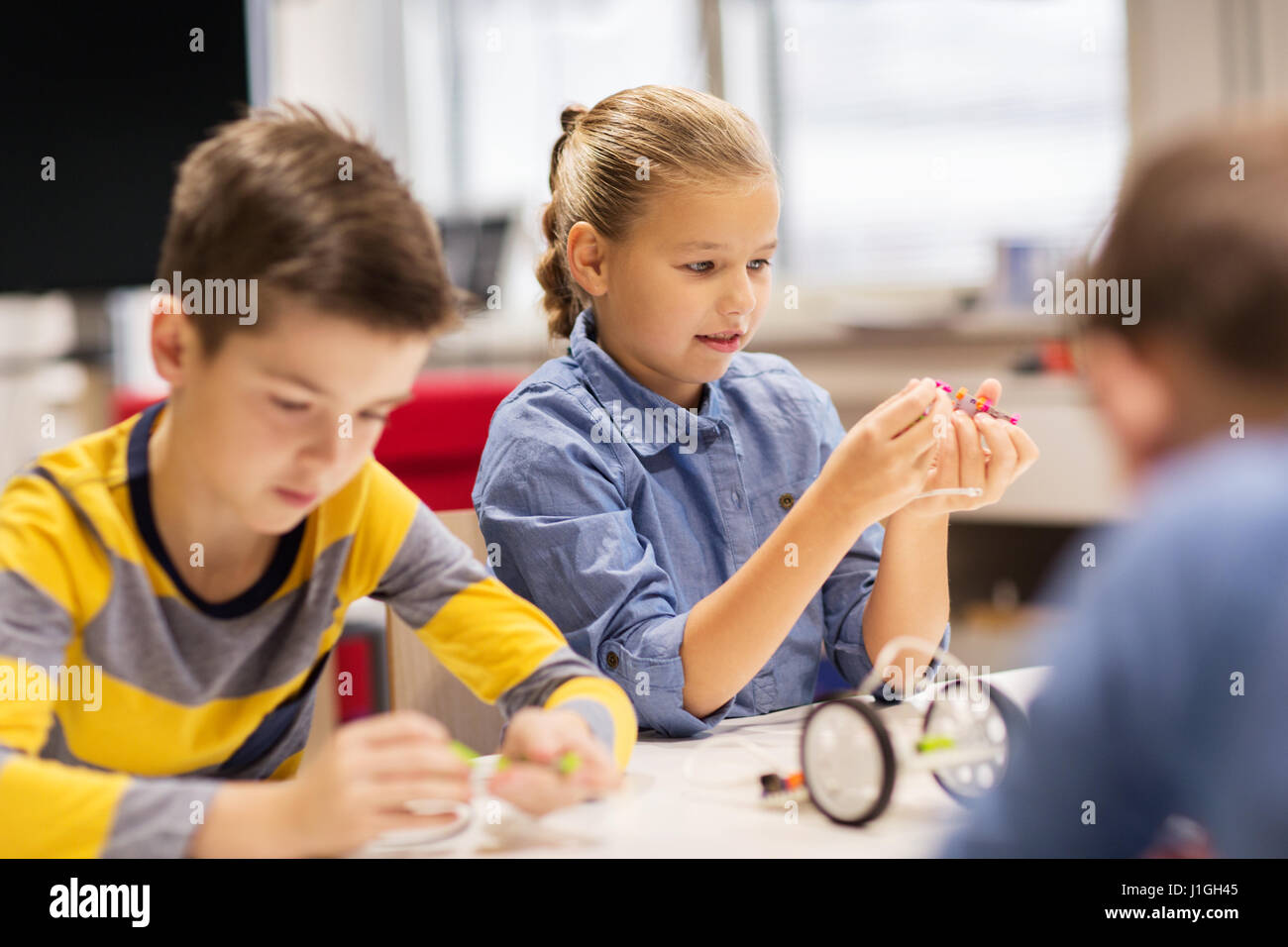 happy children building robots at robotics school Stock Photo - Alamy