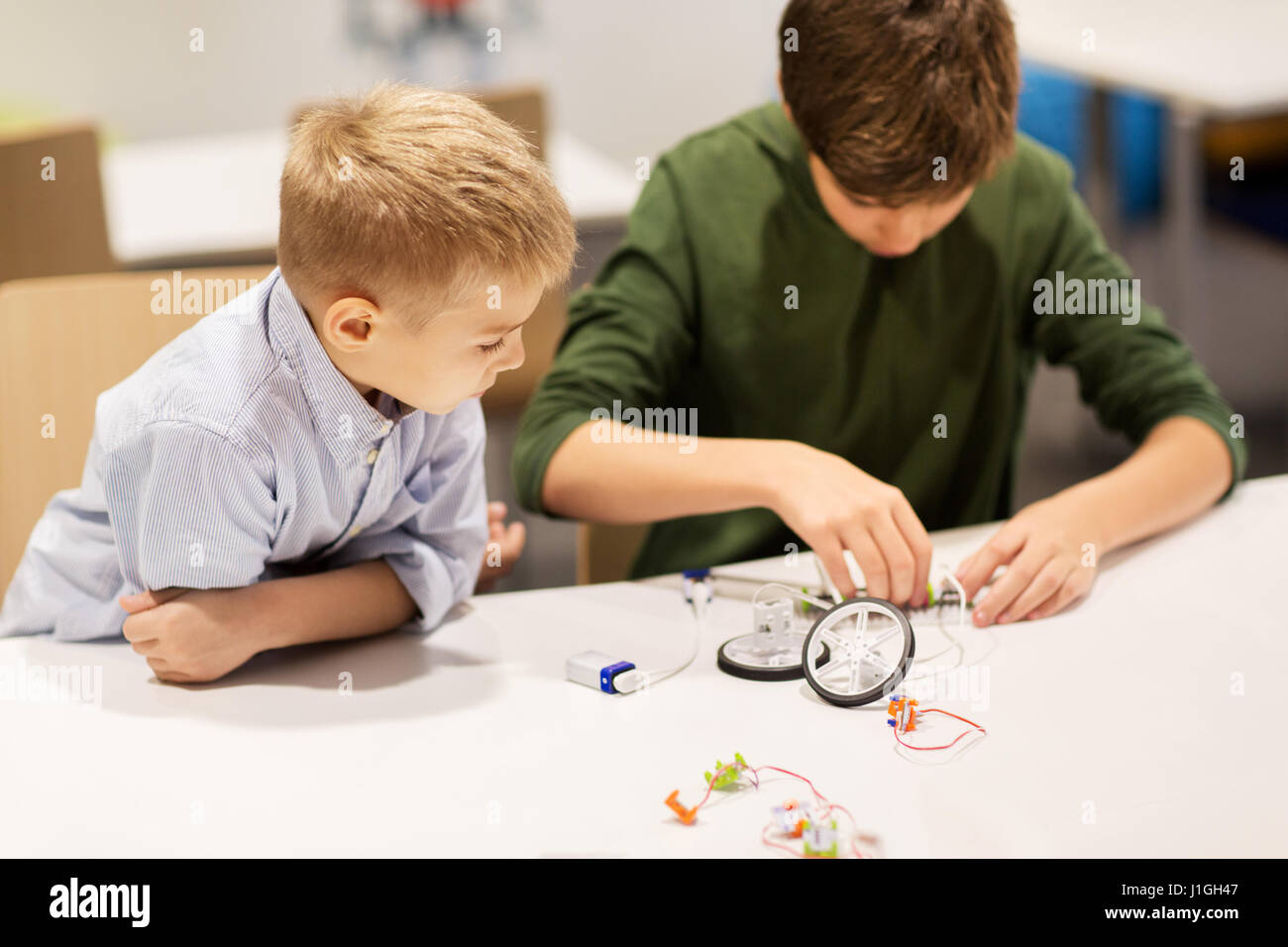 happy children building robots at robotics school Stock Photo - Alamy