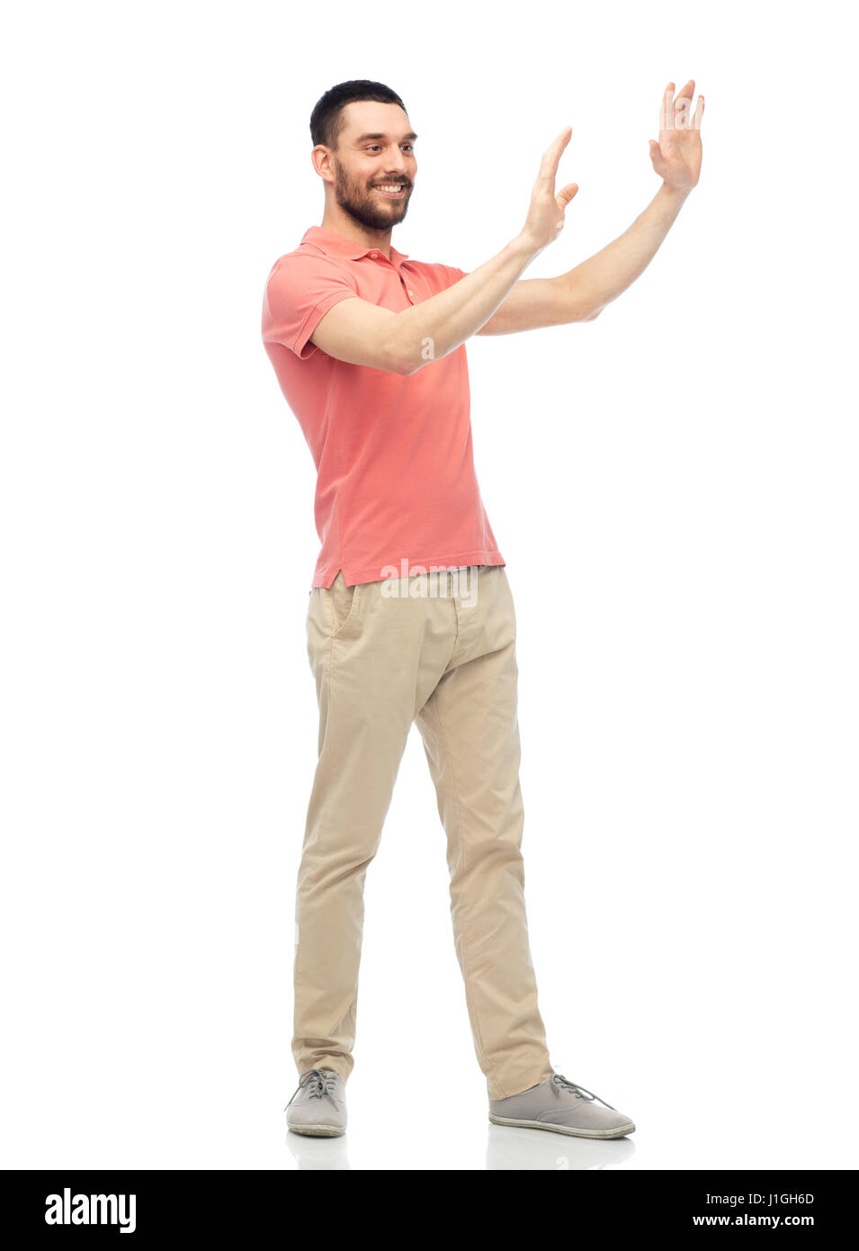 happy man touching something imaginary Stock Photo - Alamy