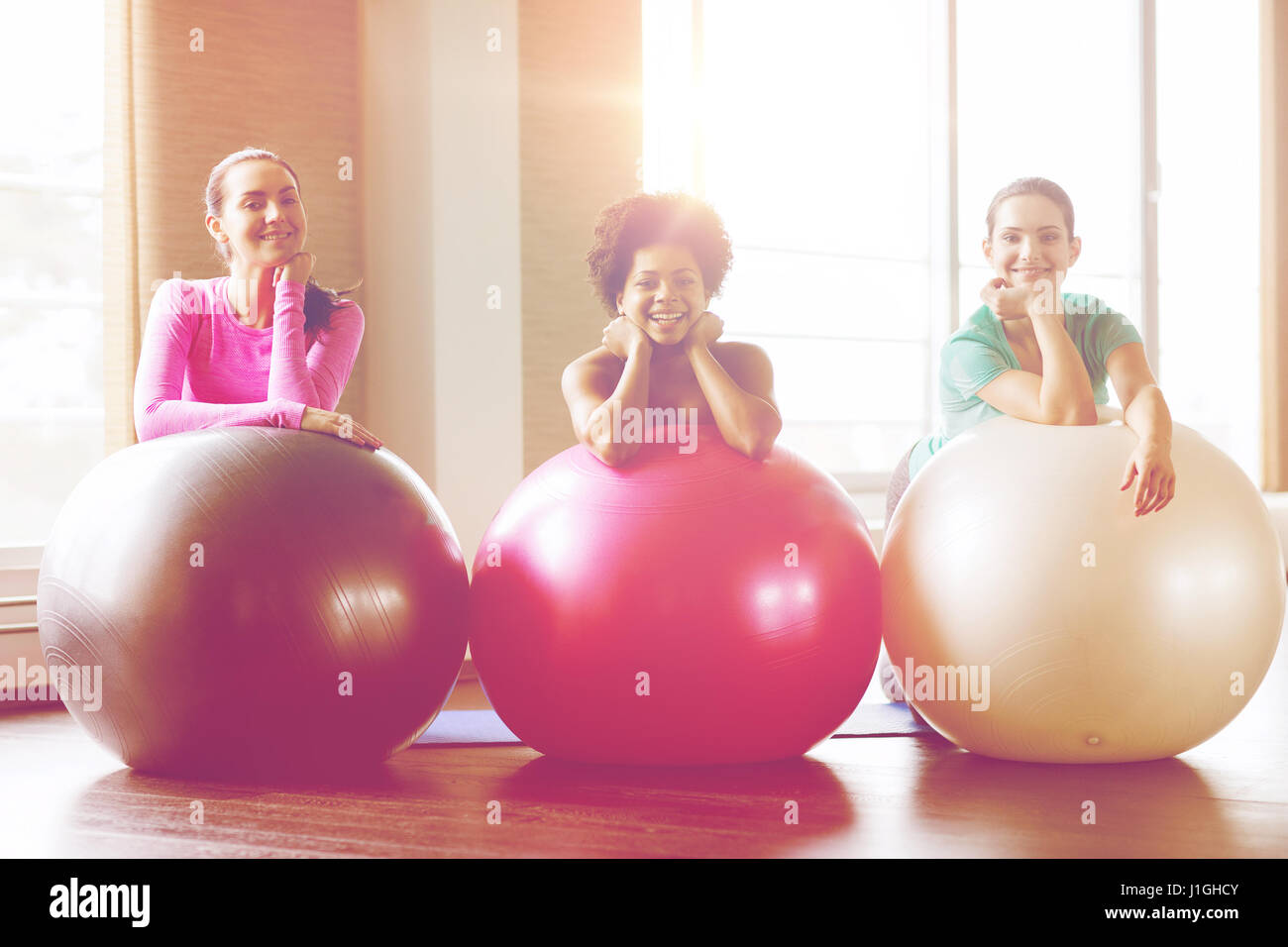 group of smiling women with exercise balls in gym Stock Photo - Alamy
