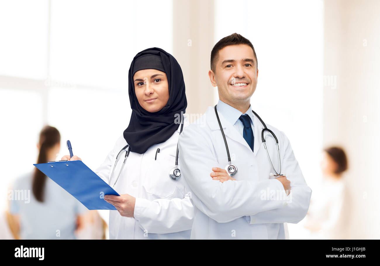 happy doctors with clipboard and stethoscopes Stock Photo - Alamy