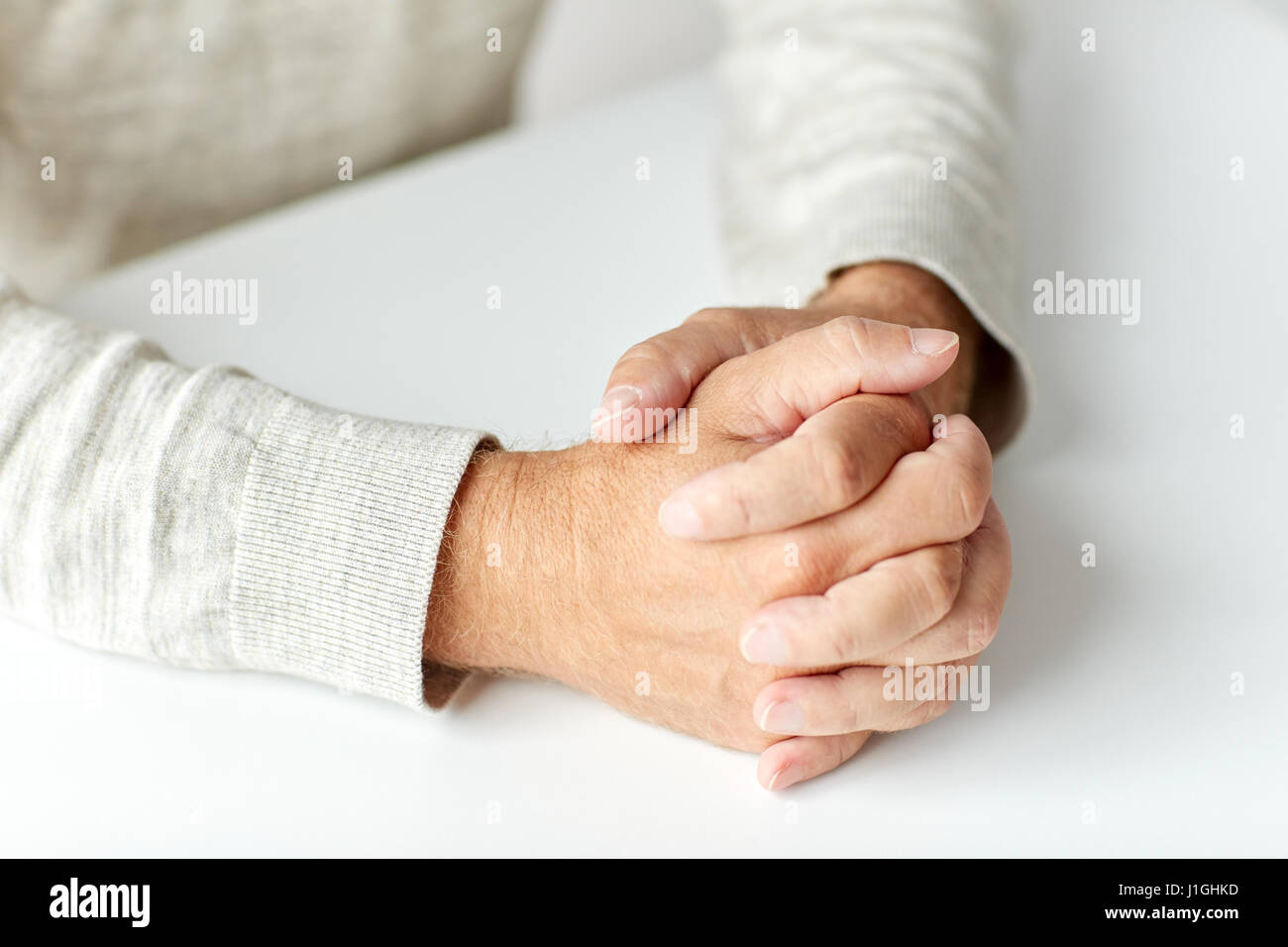Man hands on table hi-res stock photography and images - Alamy