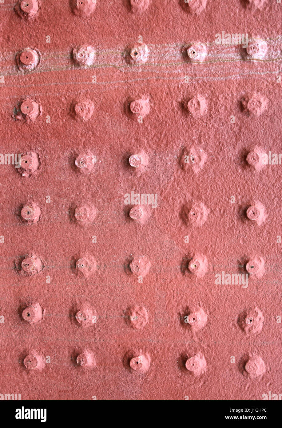 Closeup of old red metal background with rivets Stock Photo - Alamy