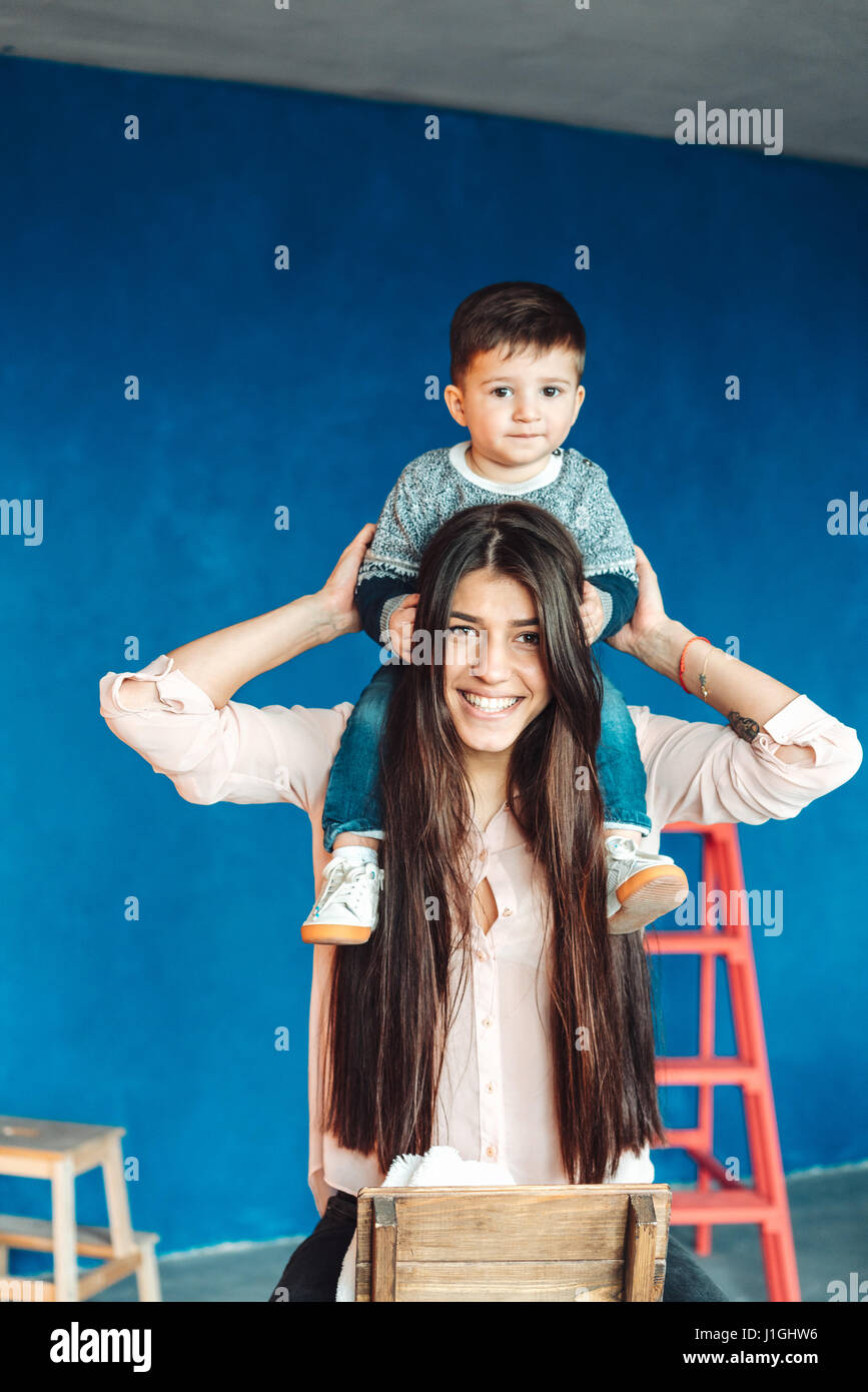 Mother and young son posing at hone Stock Photo - Alamy