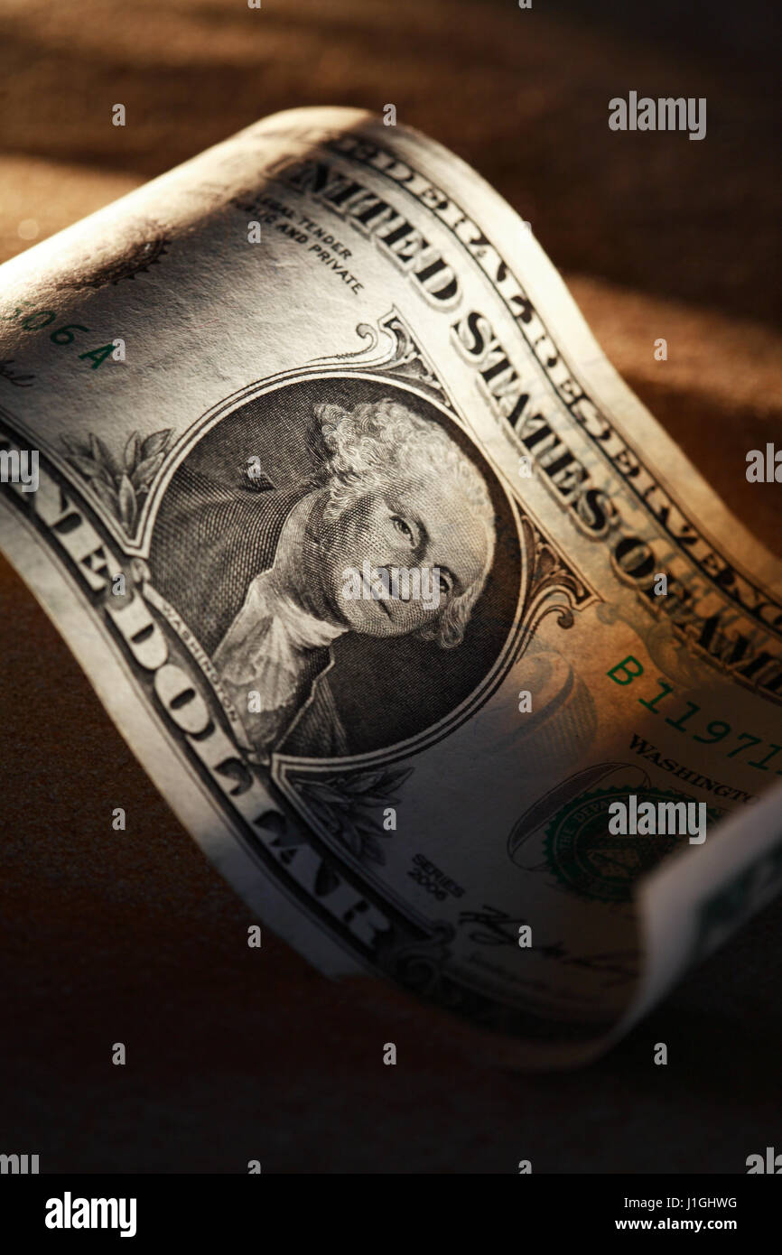 One dollar bank note closeup on dark sand background with shadow Stock ...