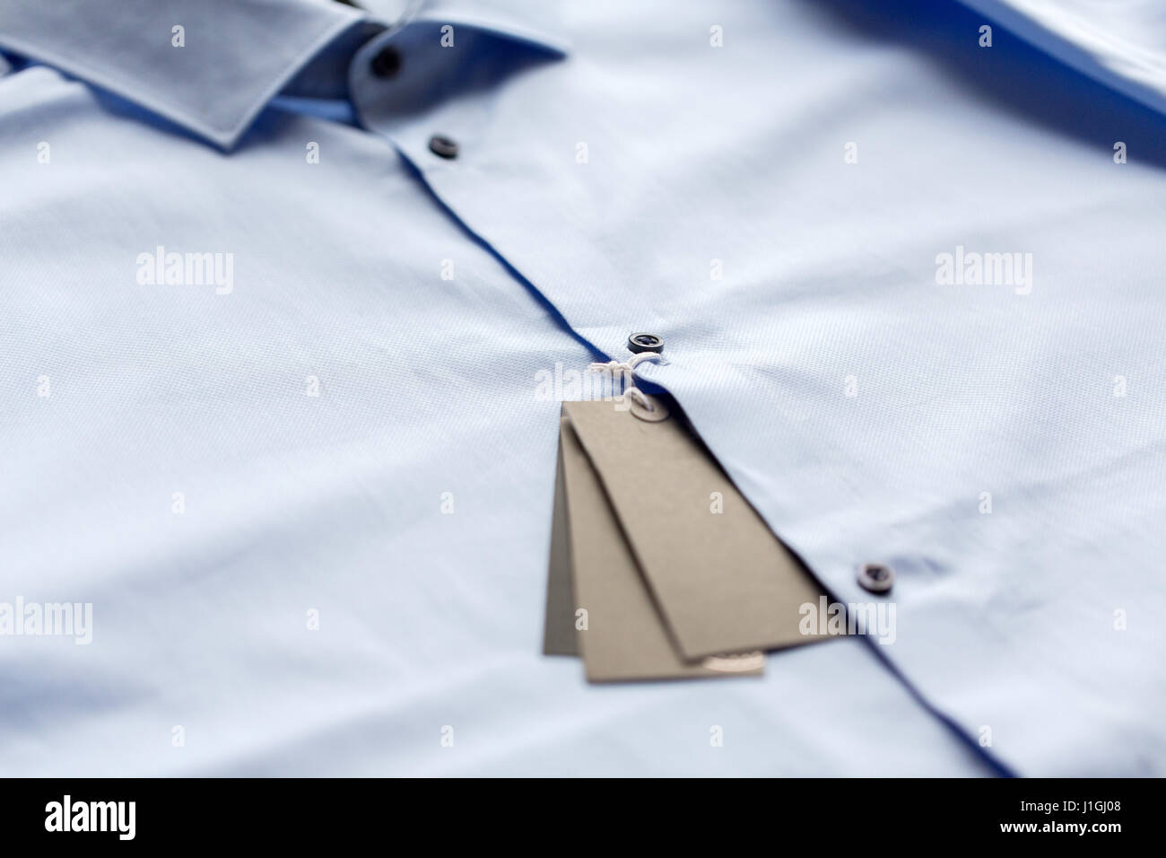 close up of shirt with price tag Stock Photo - Alamy