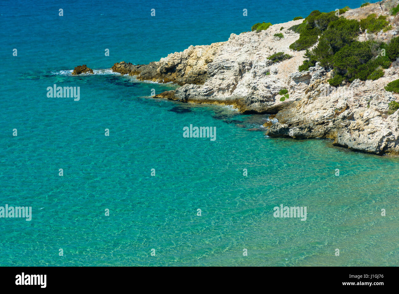 Isolated rock in the sea, on the beaches of Greece and Sicily Stock ...