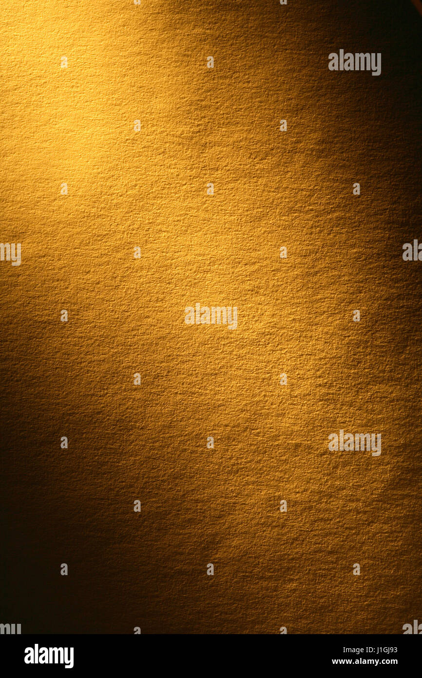 Old yellow paper surface with beam of light. Good background for your ...