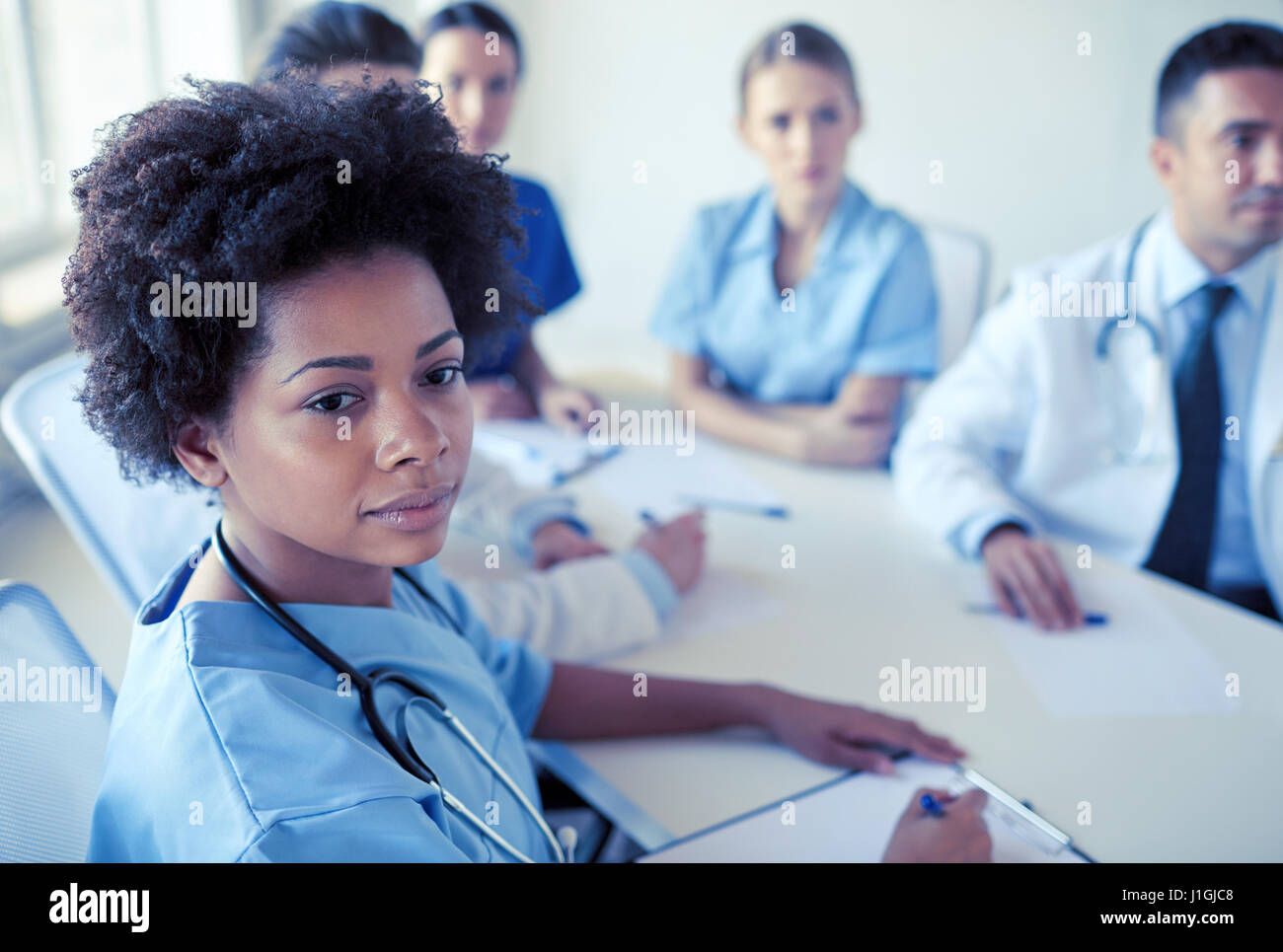 female doctor over group of medics at hospital Stock Photo - Alamy