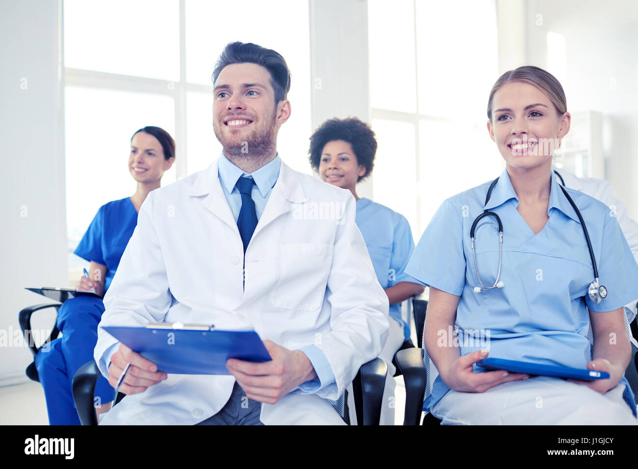 Group doctors listening presentation hi-res stock photography and ...