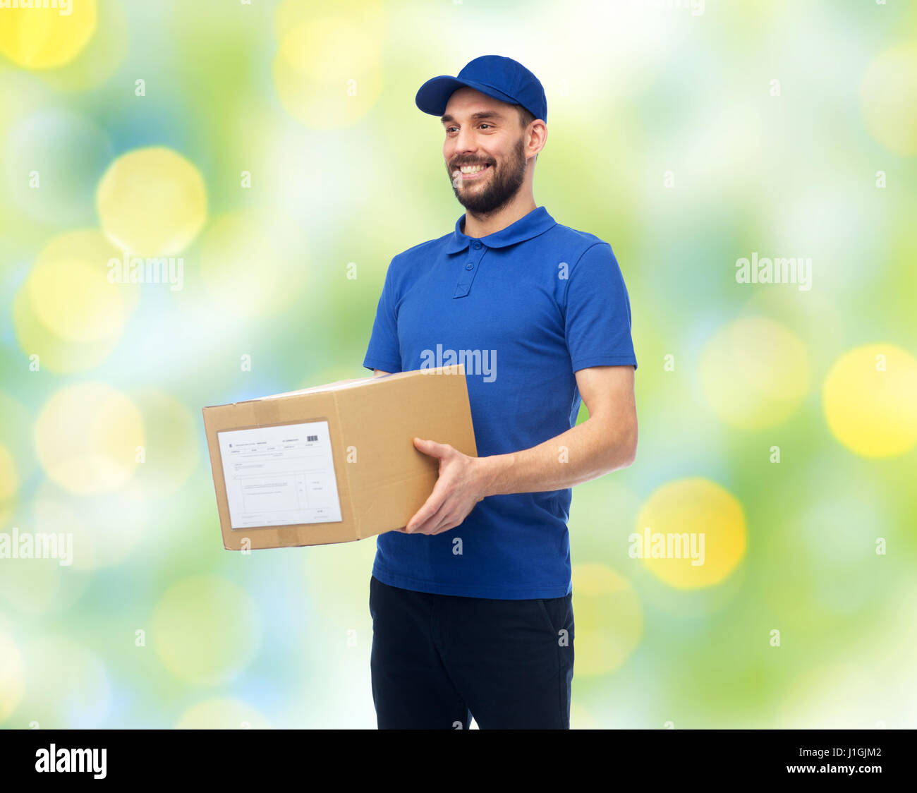 happy delivery man with parcel box Stock Photo - Alamy