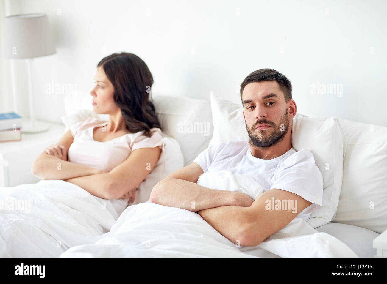 unhappy couple having conflict in bed at home Stock Photo - Alamy