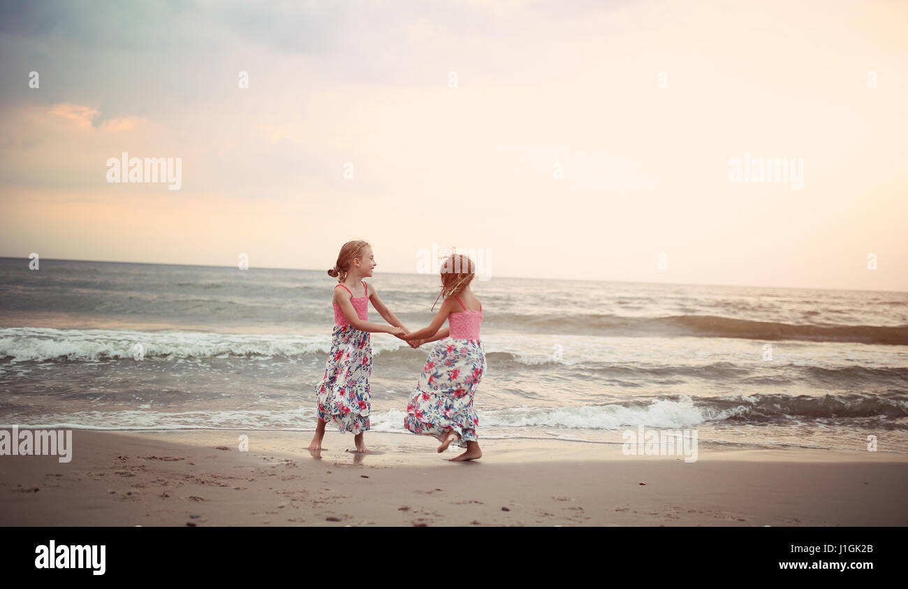 Friends have fun on the sunny beach Stock Photo - Alamy