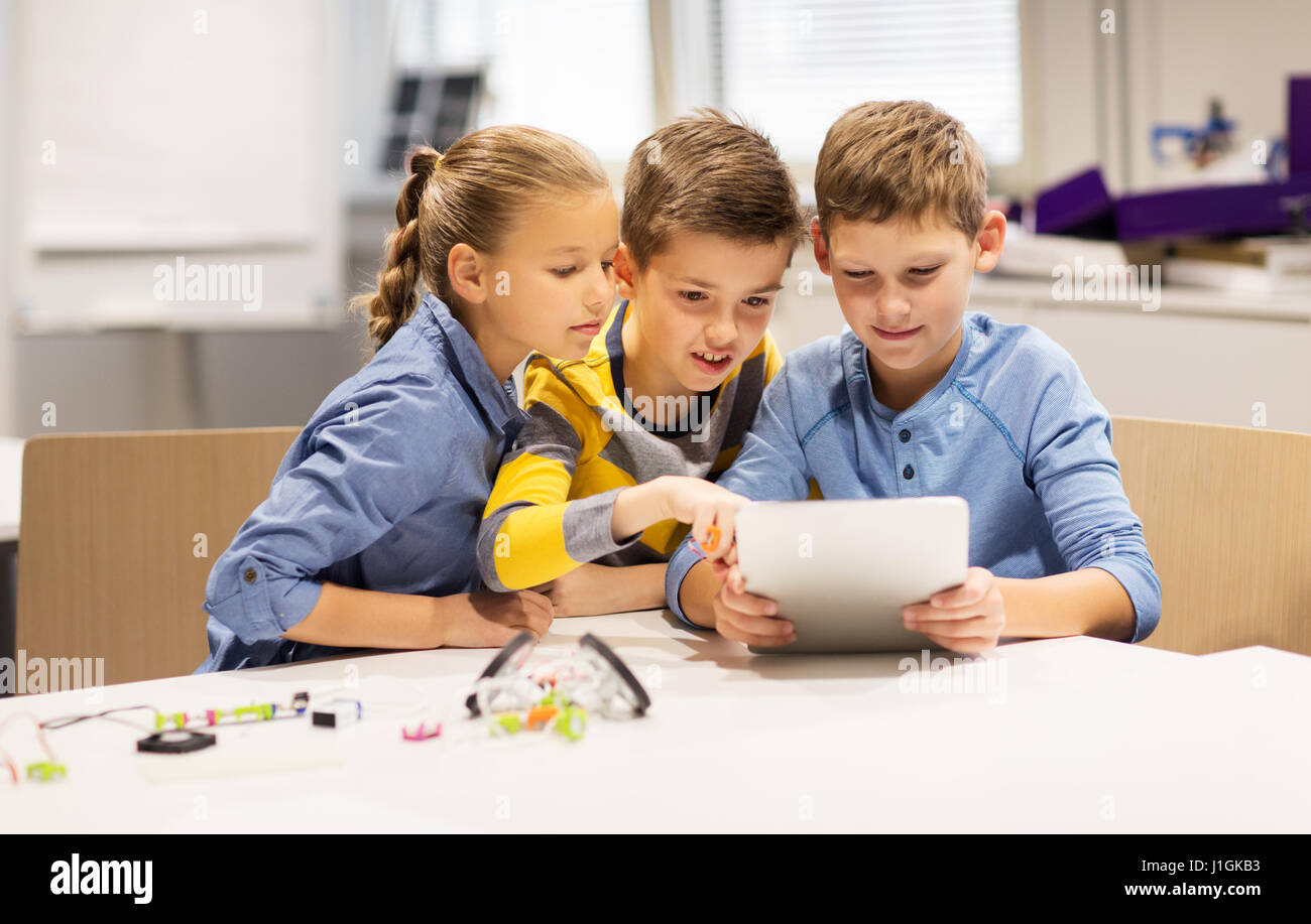 kids with tablet pc programming at robotics school Stock Photo - Alamy