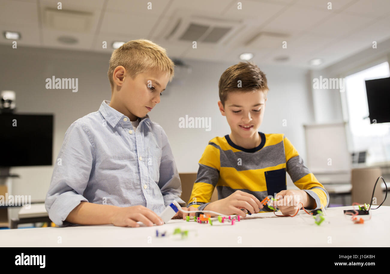 happy children building robots at robotics school Stock Photo - Alamy