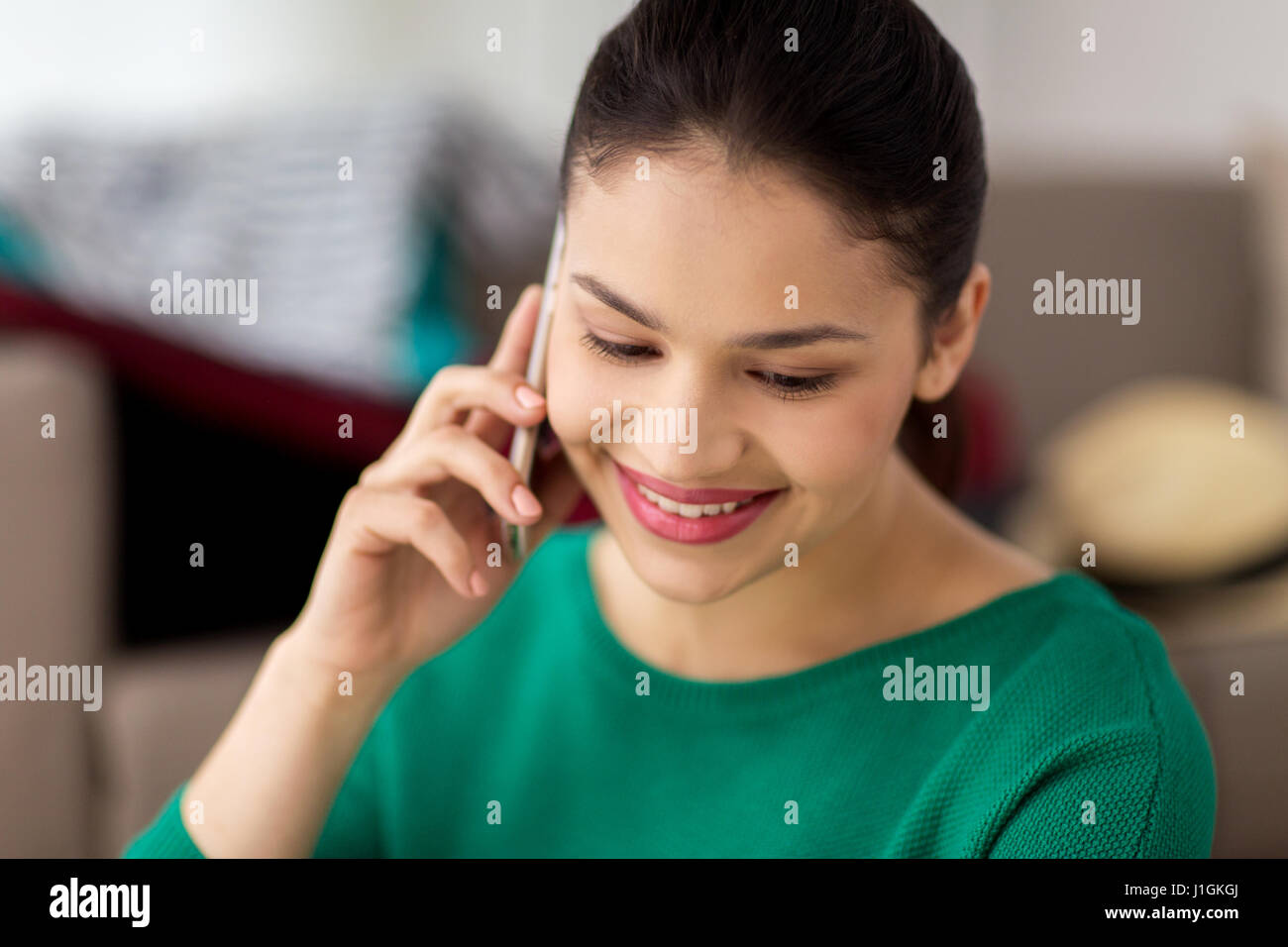happy woman calling on smartphone at home Stock Photo - Alamy