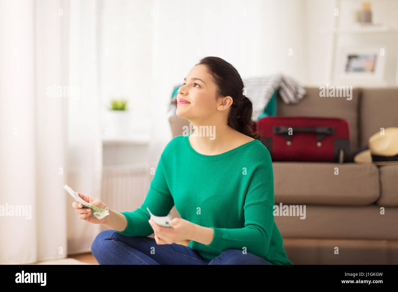 Happy traveler woman thinking hi-res stock photography and images - Alamy