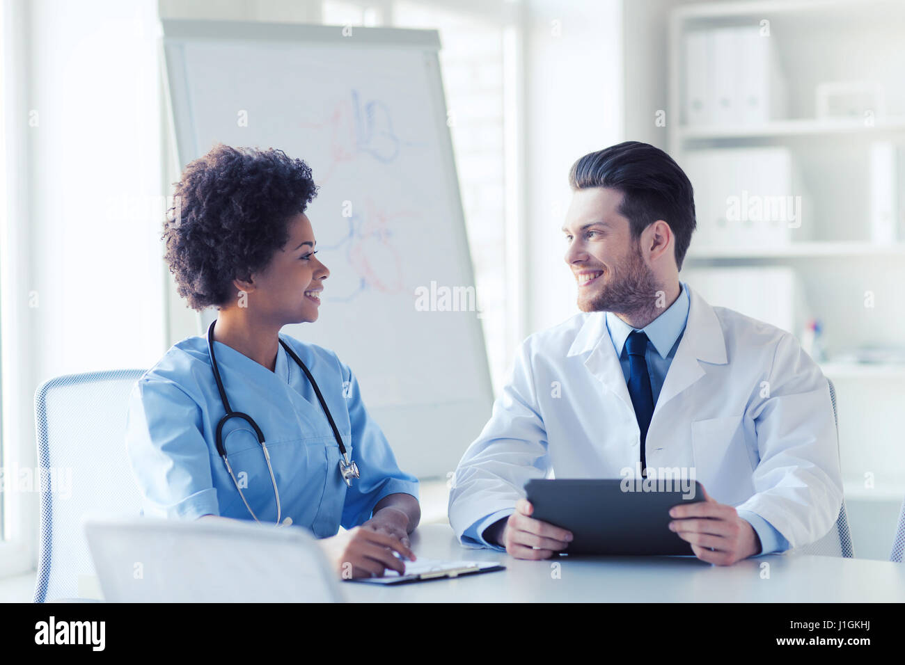 two happy doctors meeting at hospital office Stock Photo - Alamy