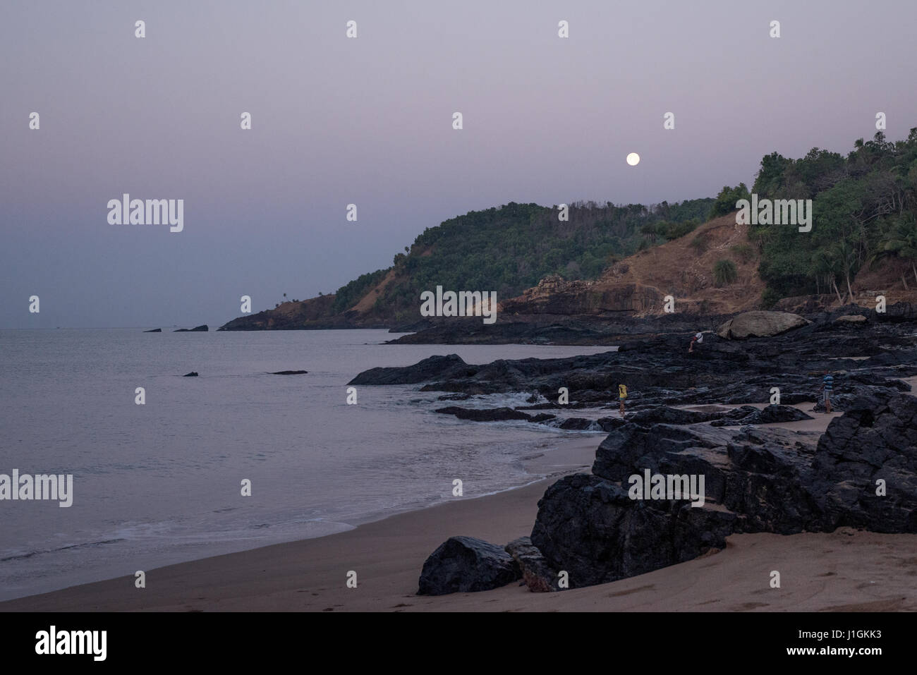 Moonset at paradise beach Stock Photo - Alamy