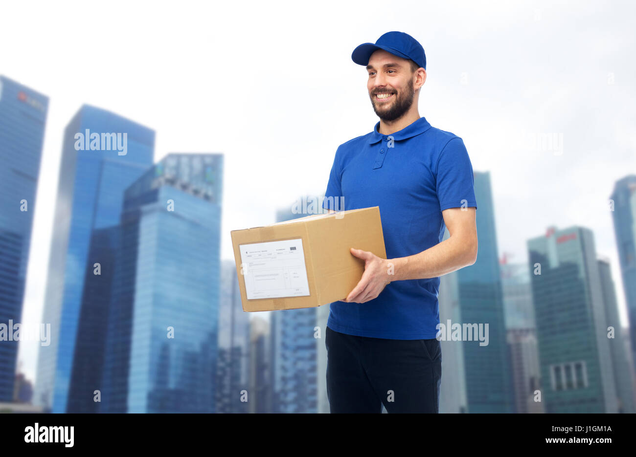 happy delivery man with parcel box Stock Photo - Alamy
