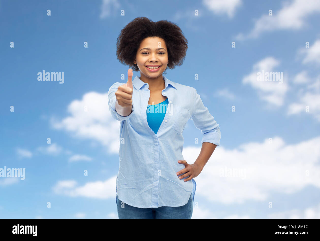 happy african american woman showing thumbs up Stock Photo - Alamy