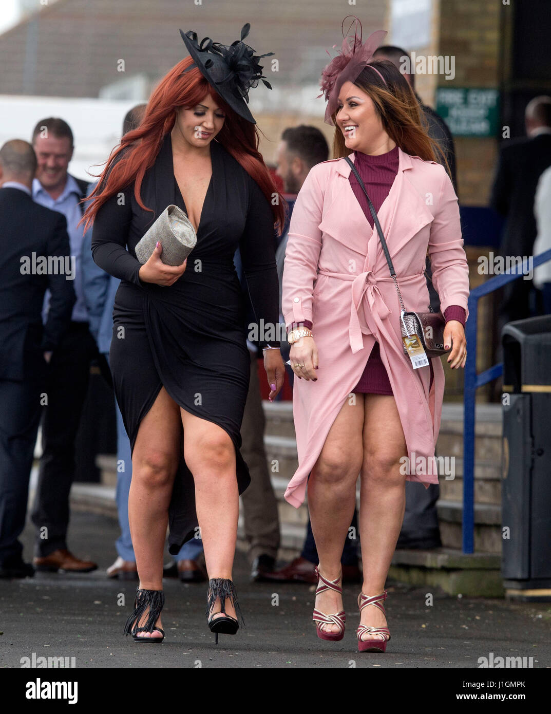 Racegoers arrive for Ladies Day of the Coral Scottish Grand National at ...