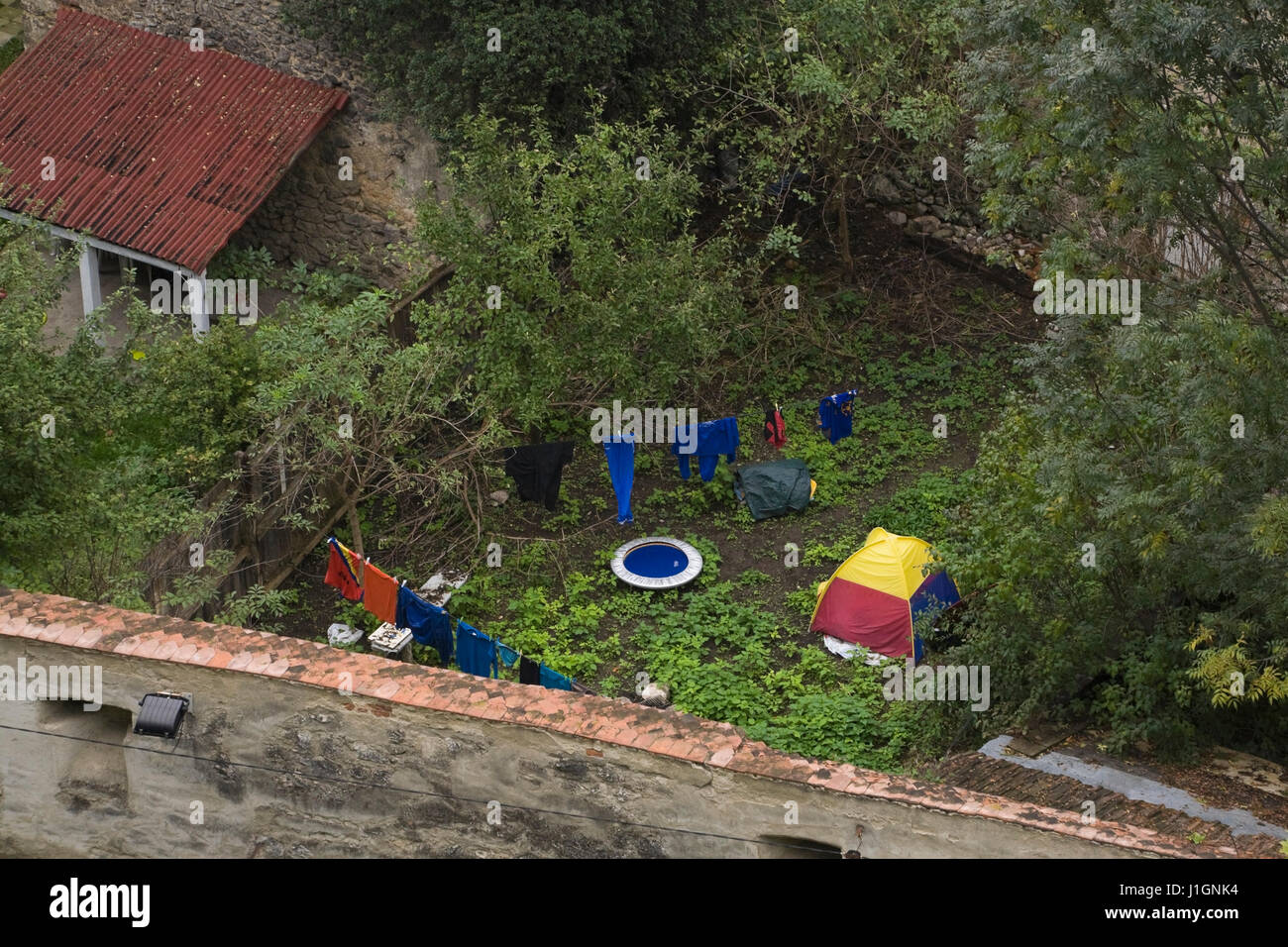 A homeless person's clotheslines and camping tent in a residential ...