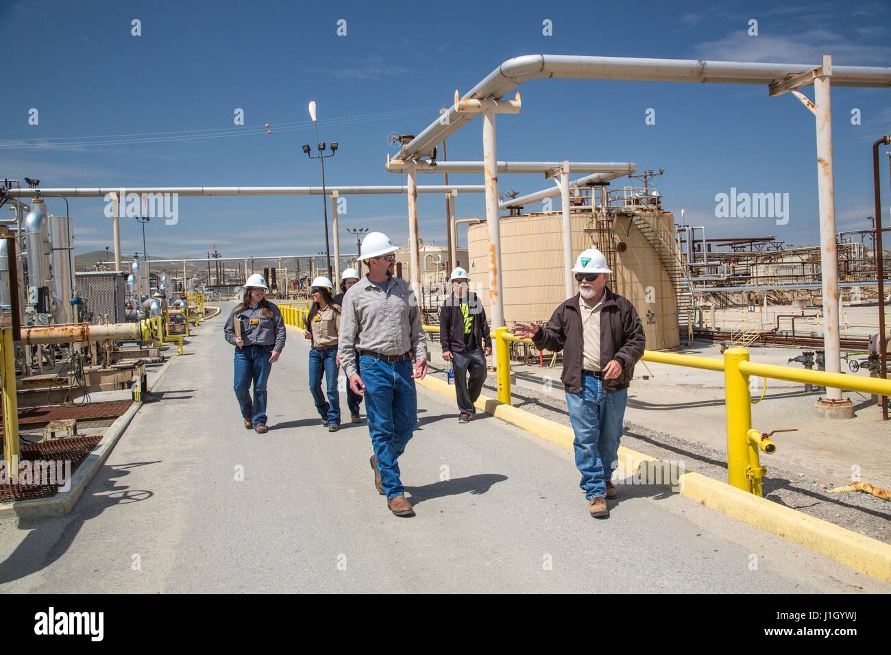A federal Bureau of Land Management team inspects crude oil storage ...