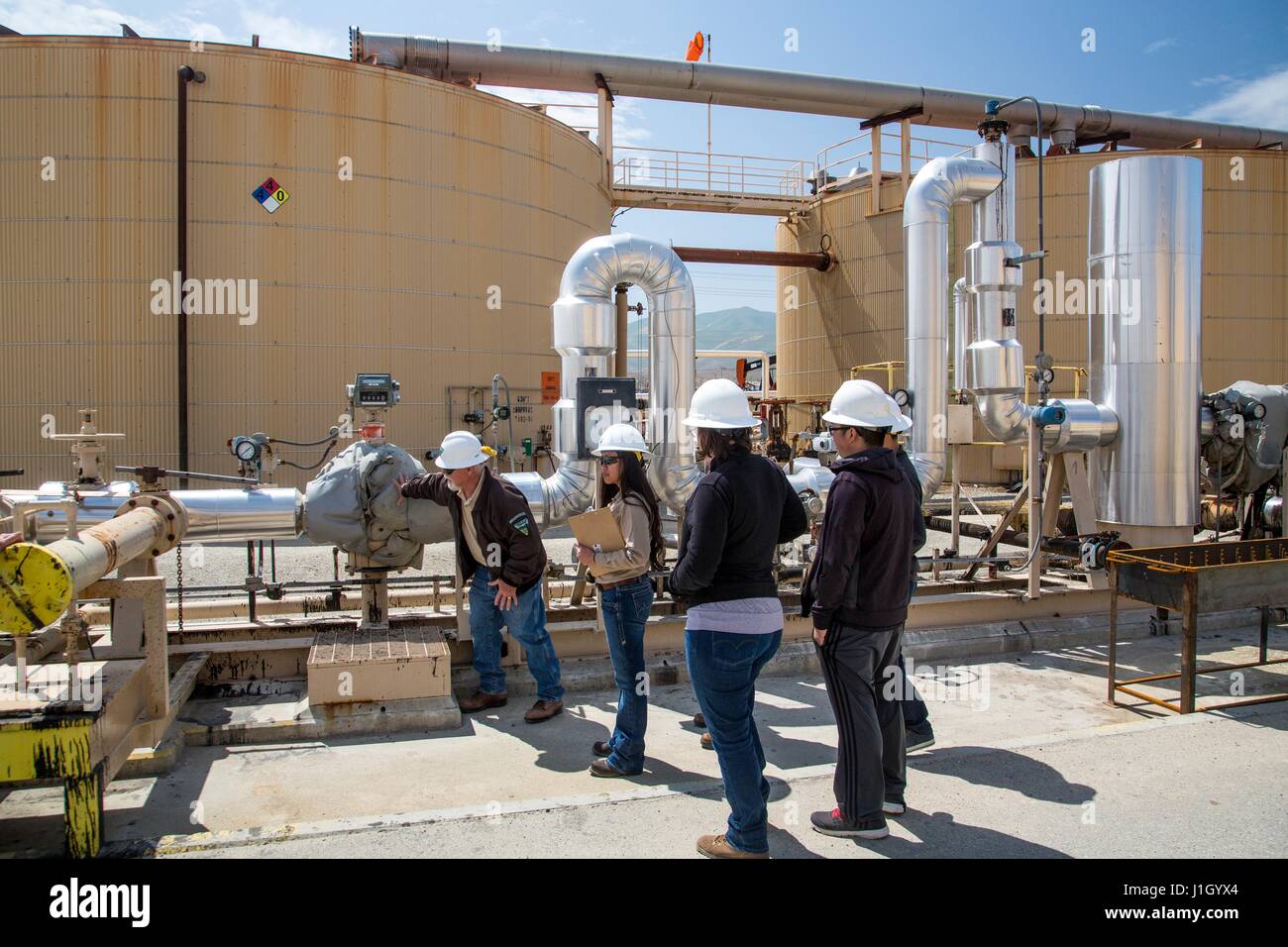 A federal Bureau of Land Management team inspects crude oil storage ...