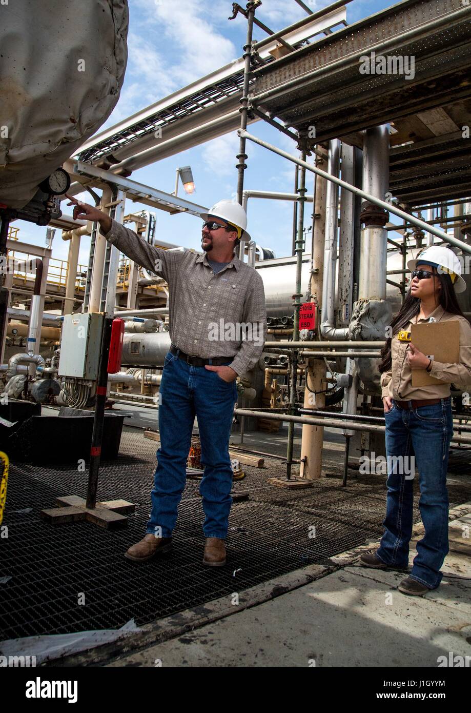 A federal Bureau of Land Management team inspects crude oil storage ...