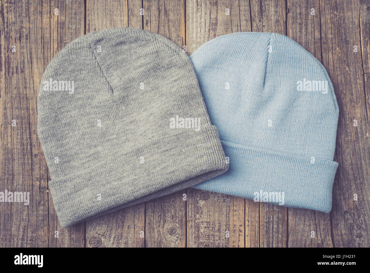 Winter caps on an old wooden table. Close up Stock Photo - Alamy