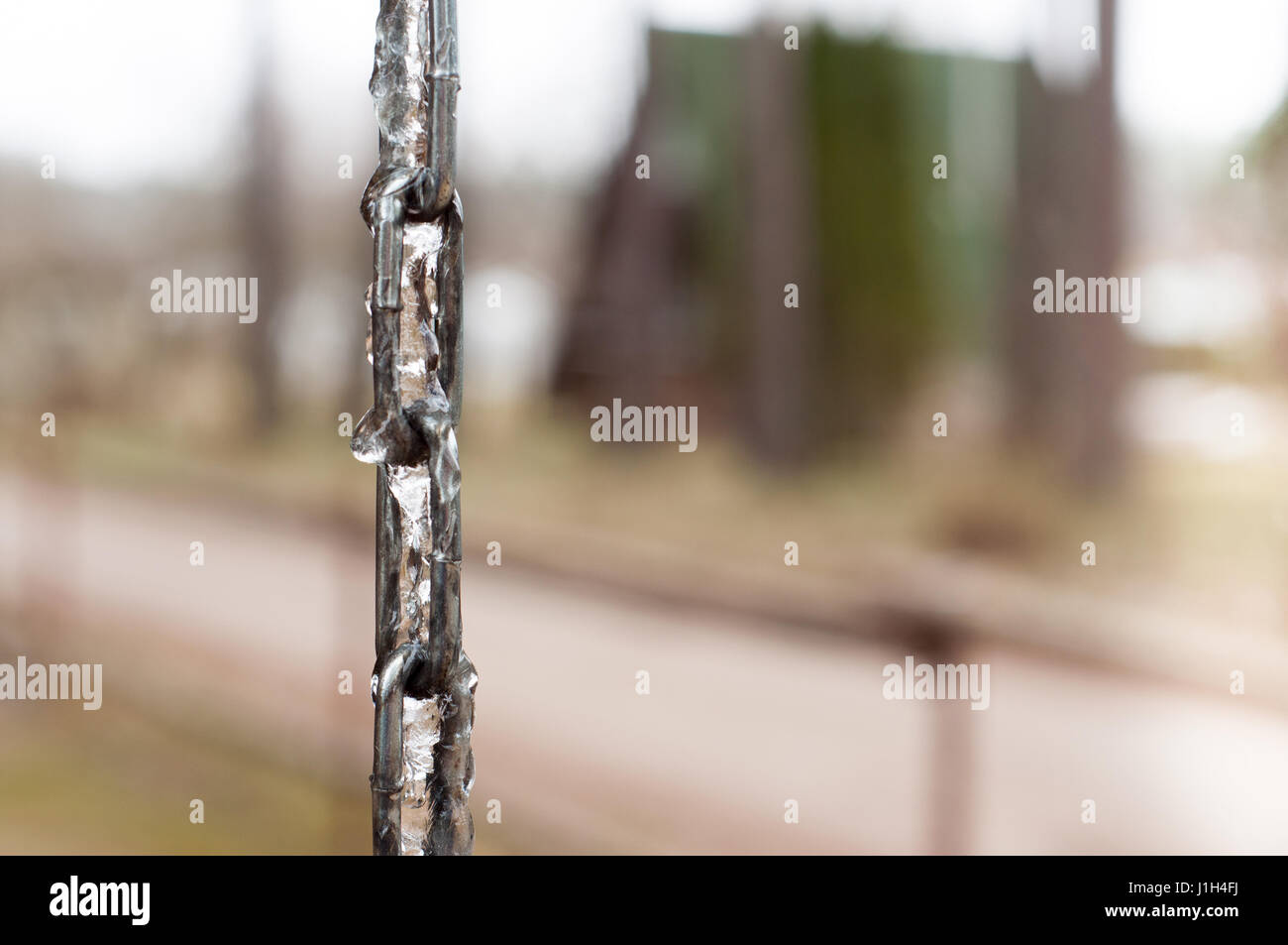 Icy winter, frozen chain Stock Photo - Alamy