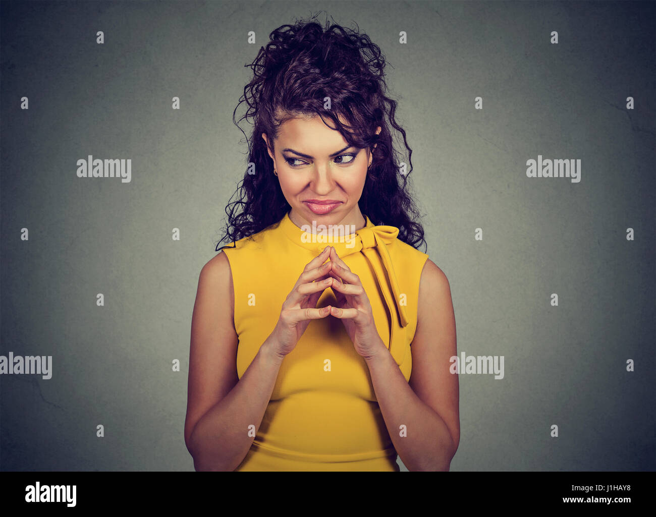 Portrait of sly, scheming young woman plotting something isolated on ...