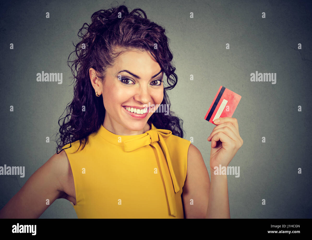 Happy woman holding credit card Stock Photo - Alamy Happy woman holding credit card Stock Photo - Alamy