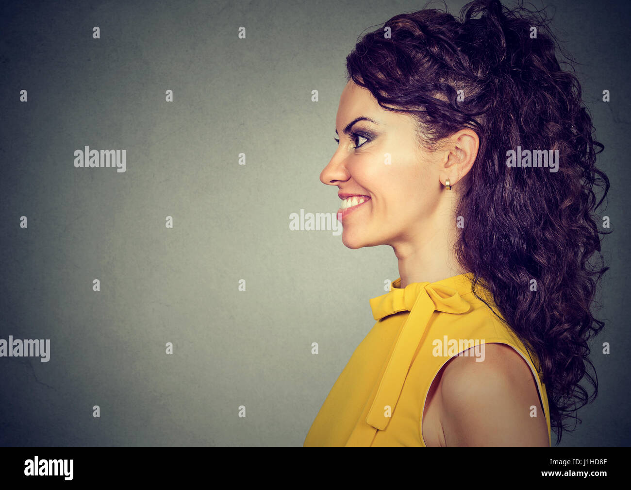 Side profile of a happy smiling woman Stock Photo - Alamy
