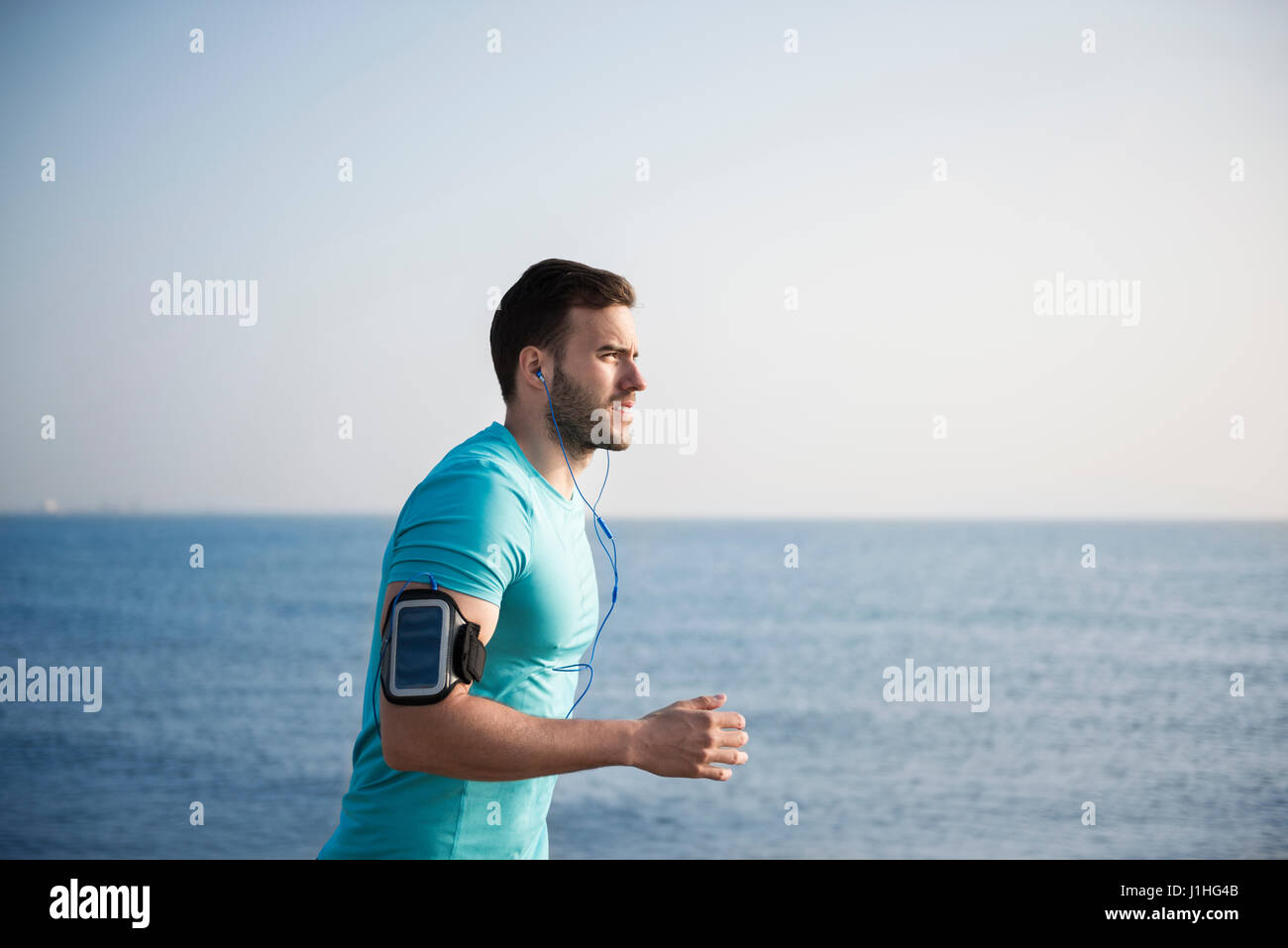 Side view of fast running man Stock Photo - Alamy