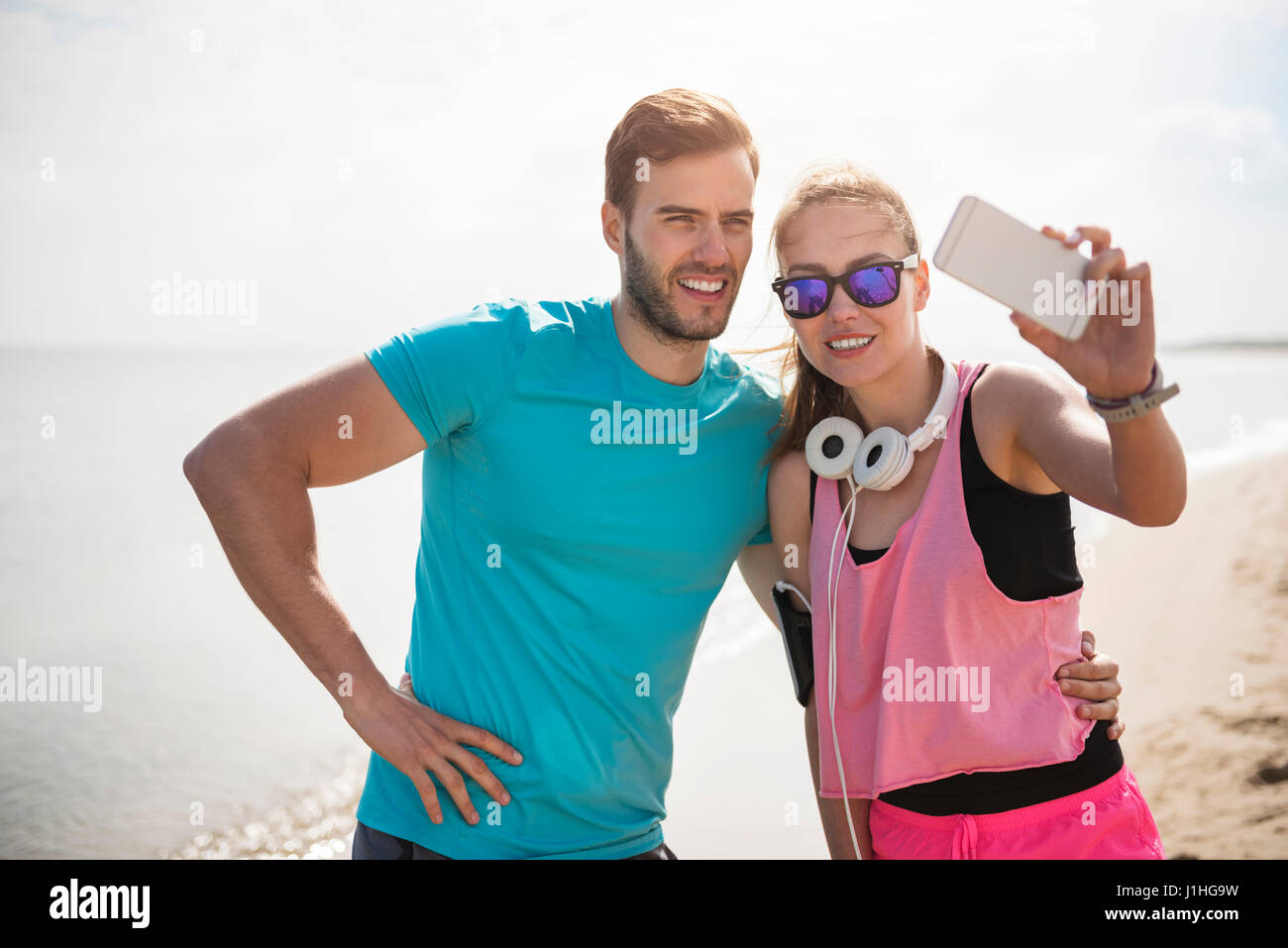 Common selfie on the beach Stock Photo - Alamy