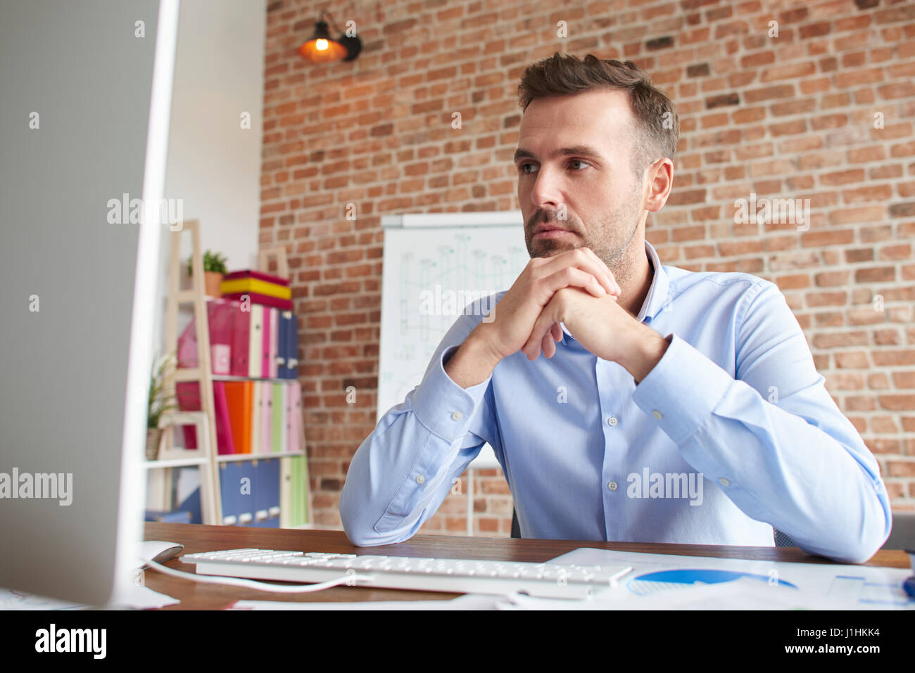 Man focused on working on computer Stock Photo - Alamy