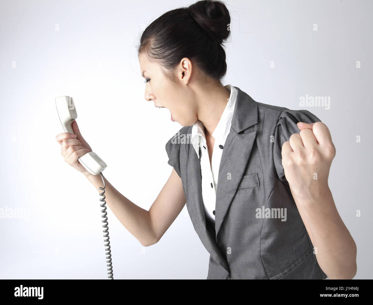 Close up woman screaming at her phone hi-res stock photography and ...