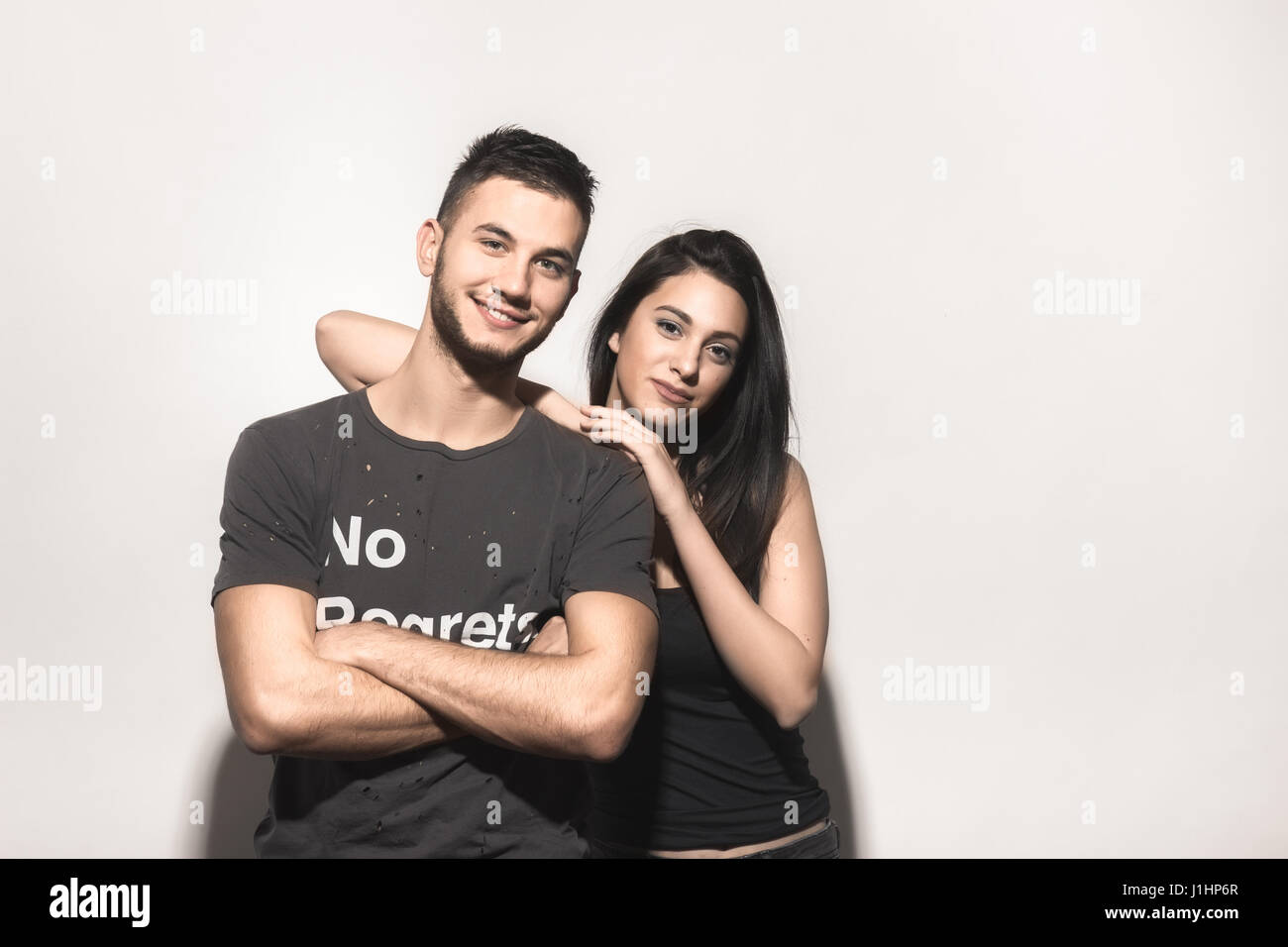 two people, young adult woman man 20s, sister brother posing, looking ...