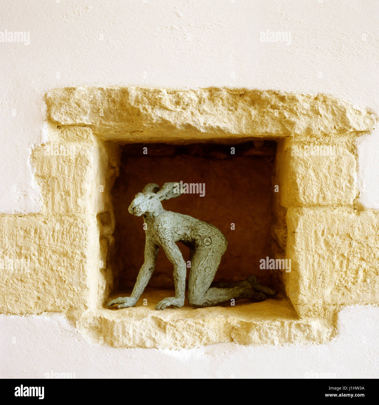 Sculpture of rabbit inside brick wall Stock Photo - Alamy