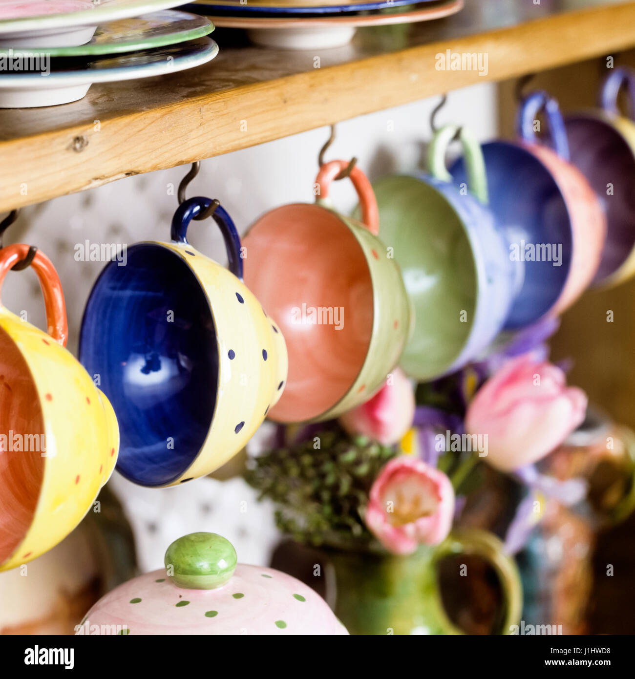 Hanging tea cups Stock Photo - Alamy