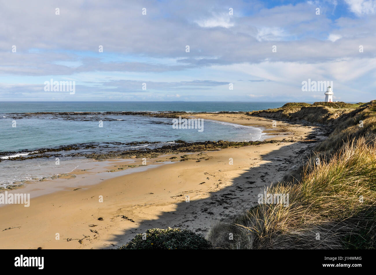 Lighthouse on the coast near Slope Point, the Southernmost point of New ...