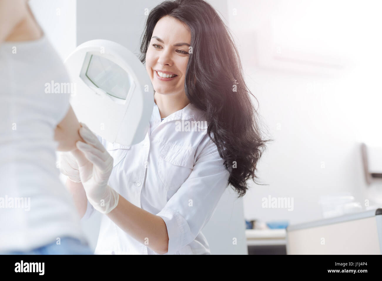 Dermatologist examination young woman hi-res stock photography and ...