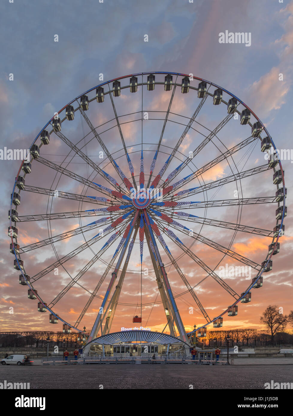 Place de la Concorde at sunset. Ferris wheel and Egyptian obelisk ...