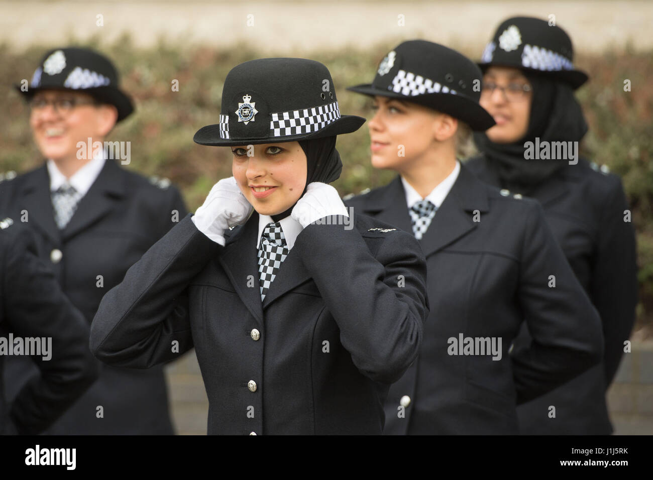 New Metropolitan Police officers check their uniforms before taking ...