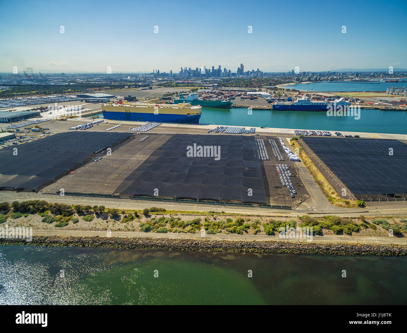 Large car carrier and other industrial ships docked at Port Melbourne ...